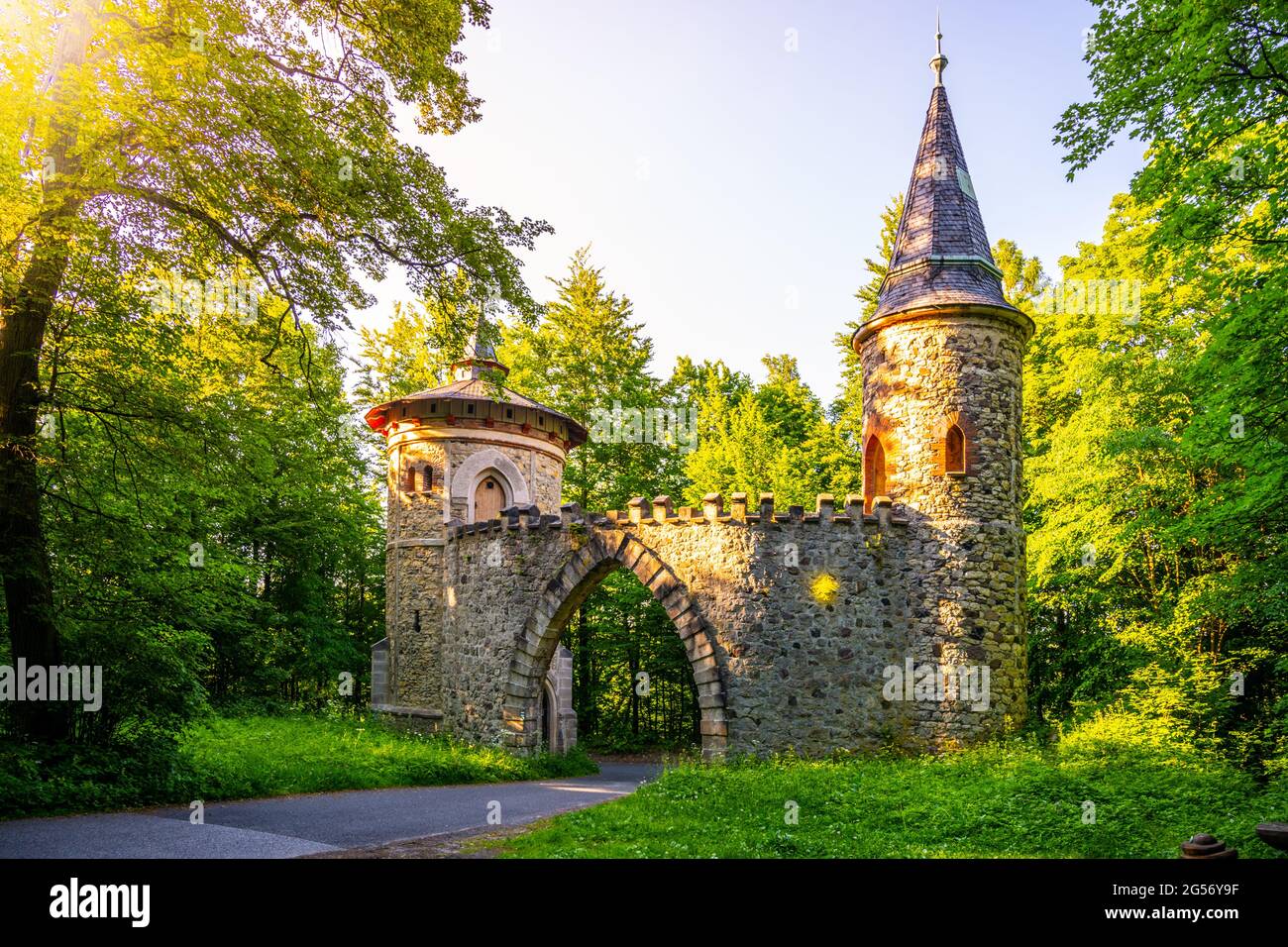 Gothic arc gate over asphalt road Stock Photo - Alamy