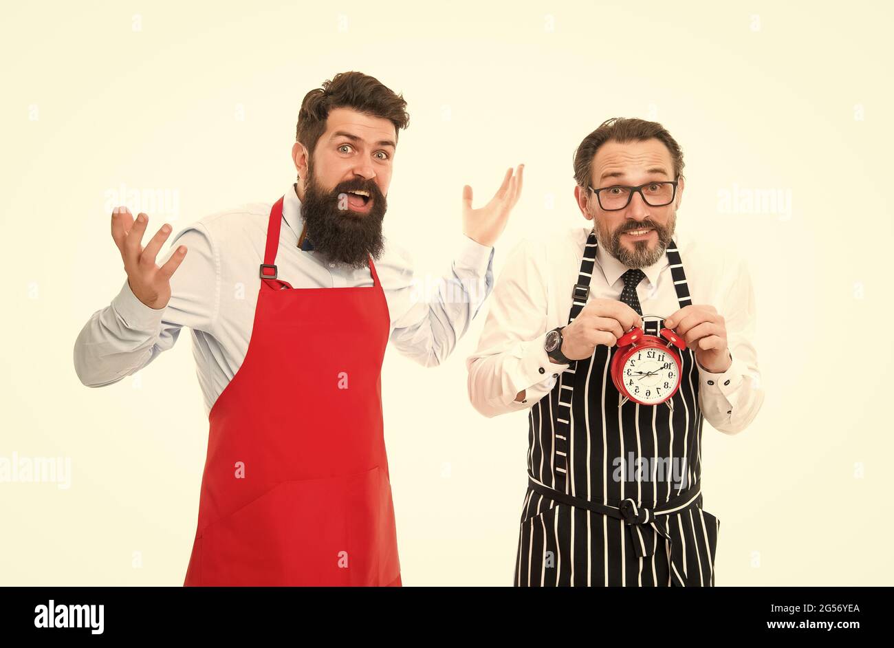 Man bearded hipster and mature chef apron white background. Working ...