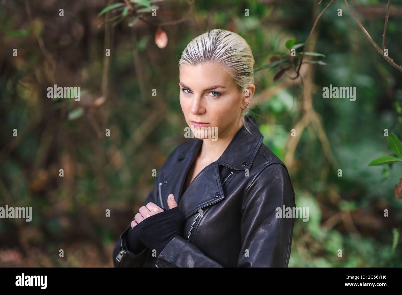 Fashion in unusual places, Young Woman in Edgy Motorcycle Jacket in the ...