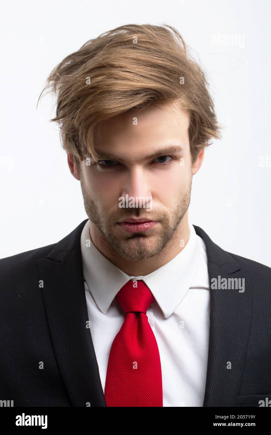 Portrait of serious young businessman, isolated on white background ...