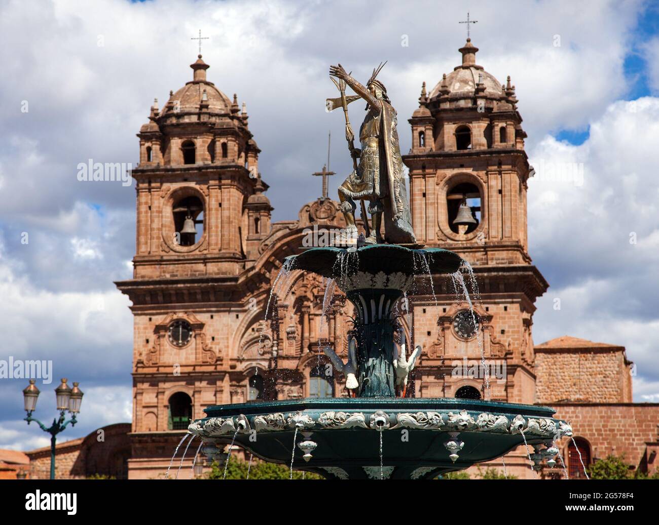 Statue of Inca Pachacutec on fountain and catholic church on Plaza de ...