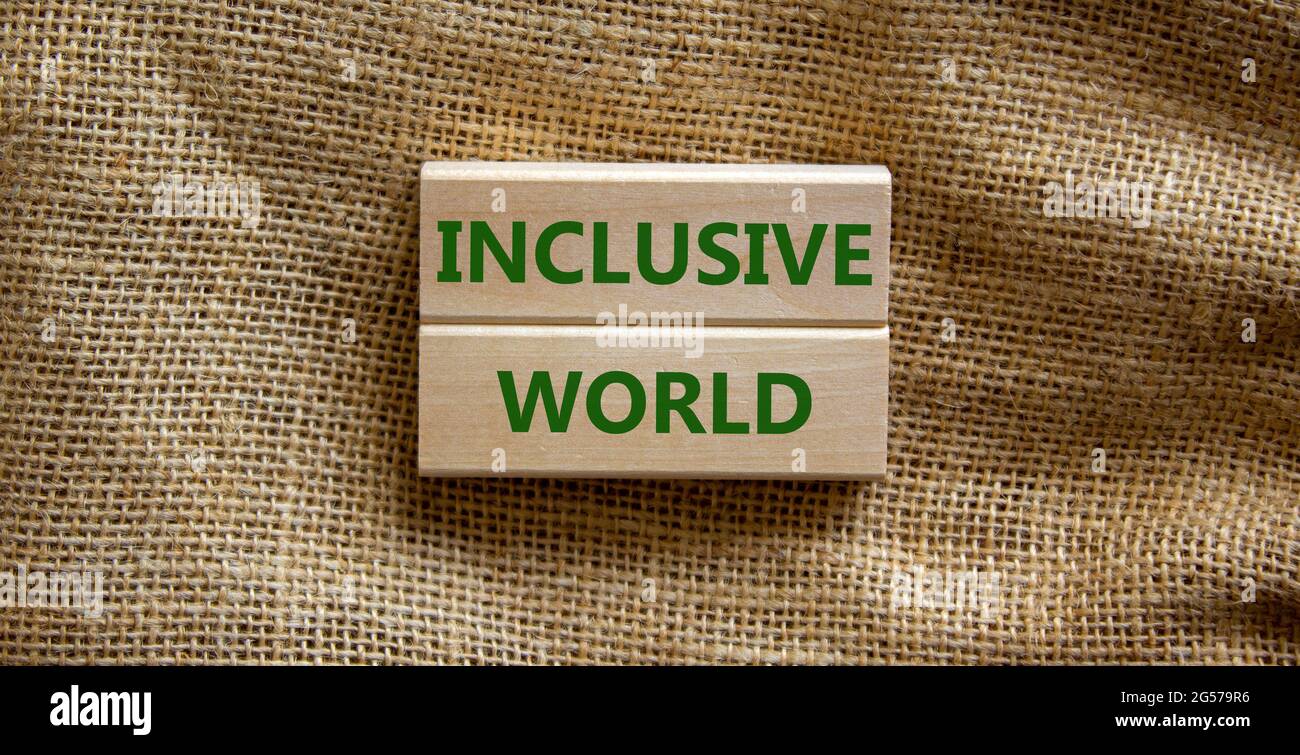 Inclusive world symbol. Wooden blocks with words Inclusive world on ...