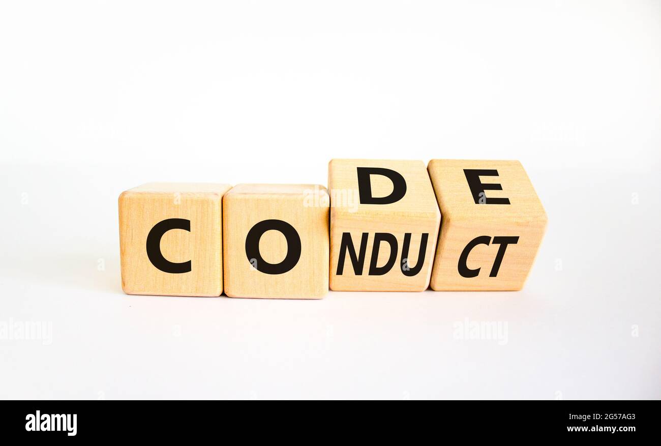 Code of conduct symbol. Turned the wooden cube and changed the word ...