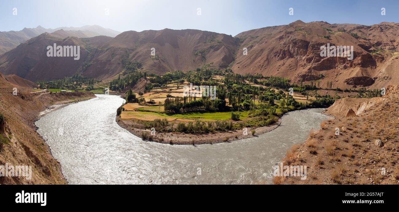 Panj river and Pamir mountains panoramic view. Panj is upper part of ...