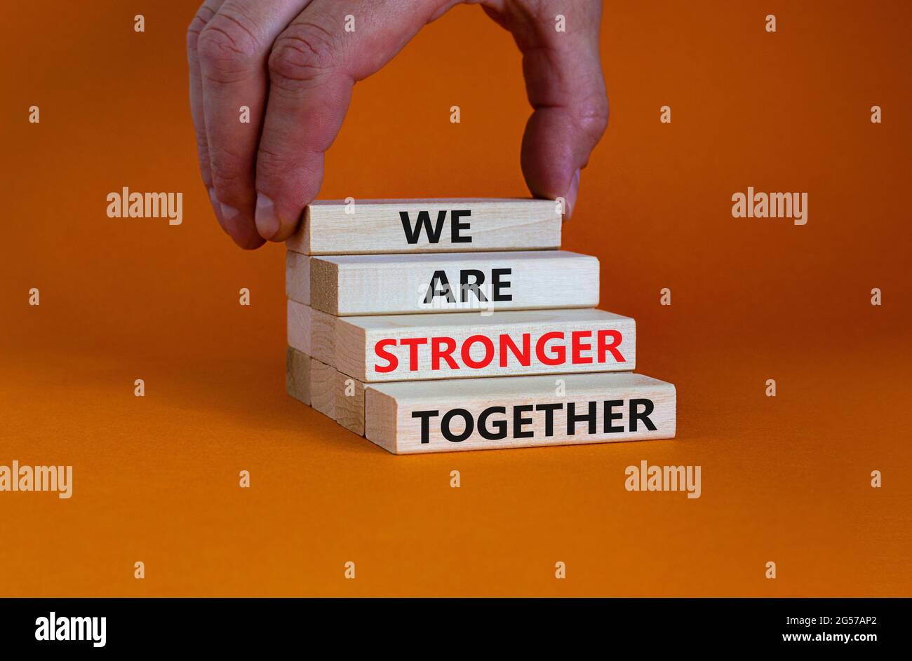 Stronger together symbol. Wooden block with words 'we are stronger ...