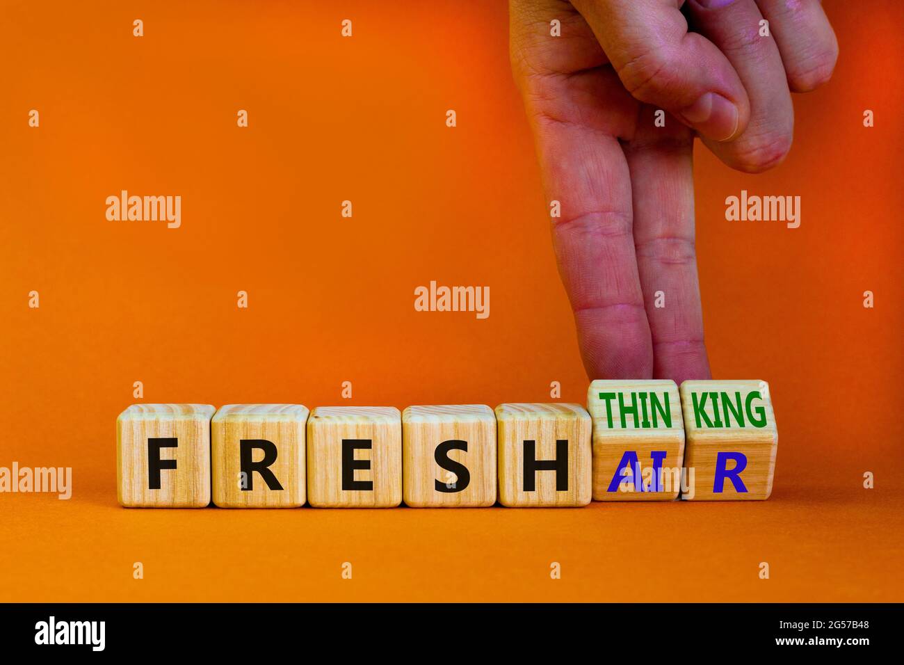 Fresh thinking and air symbol. Businessman turns wooden cubes, changes ...