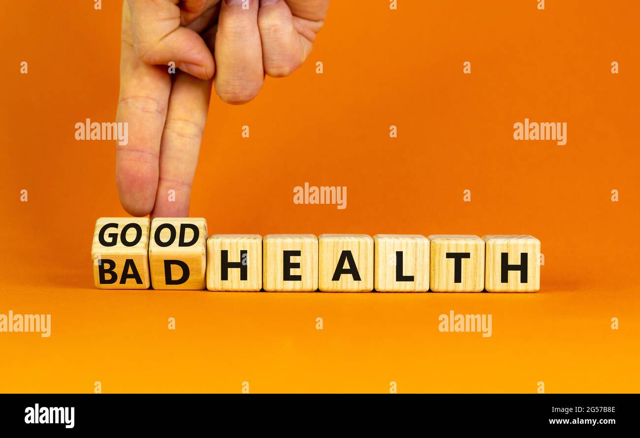Good or bad health symbol. Doctor turns wooden cubes and changes words ...