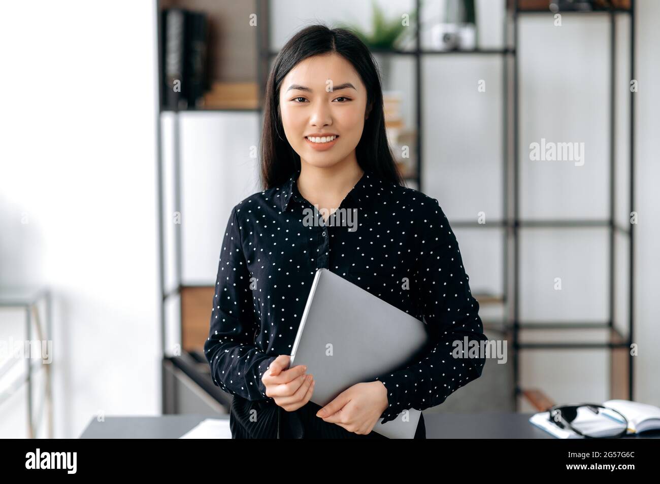 Portrait of a confident, pretty, young japanese or chinese woman ...