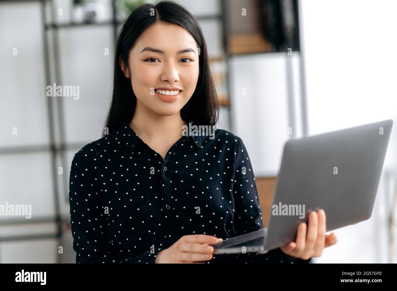 Portrait of cute successful asian young business woman, manager or ...