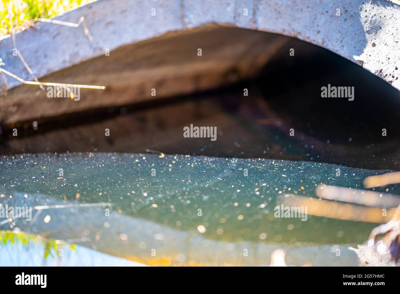 full capacity concrete culvert with sheen contaminated storm water ...