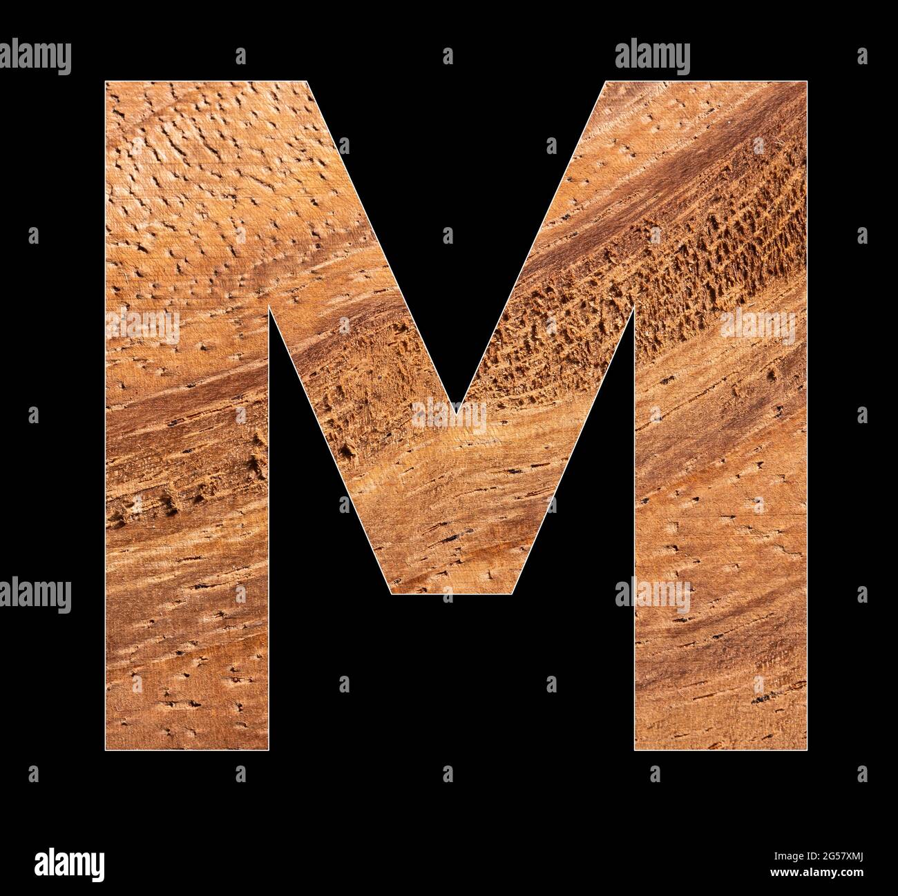 Alphabet letter M on rustic wooden background Stock Photo - Alamy
