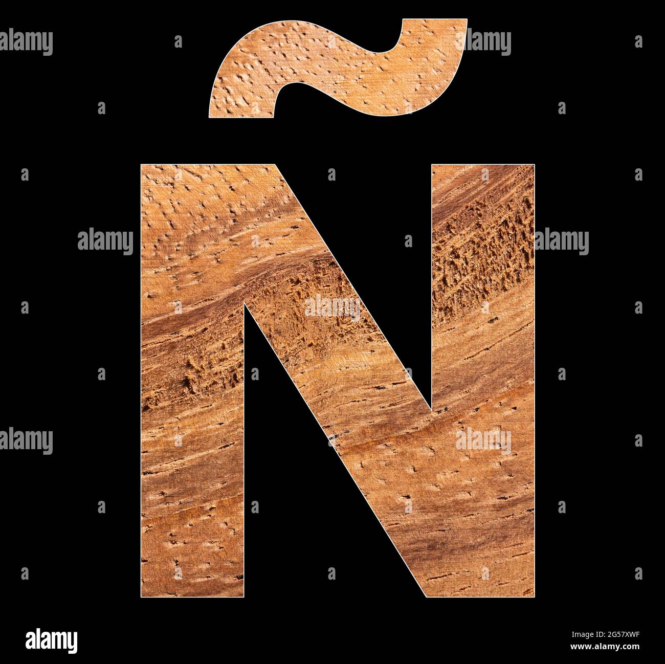 Alphabet letter Ñ on rustic wooden background Stock Photo - Alamy