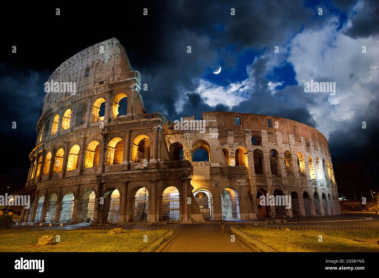 Coliseum or Flavius Amphitheater by night with clouds, Rome Stock Photo ...