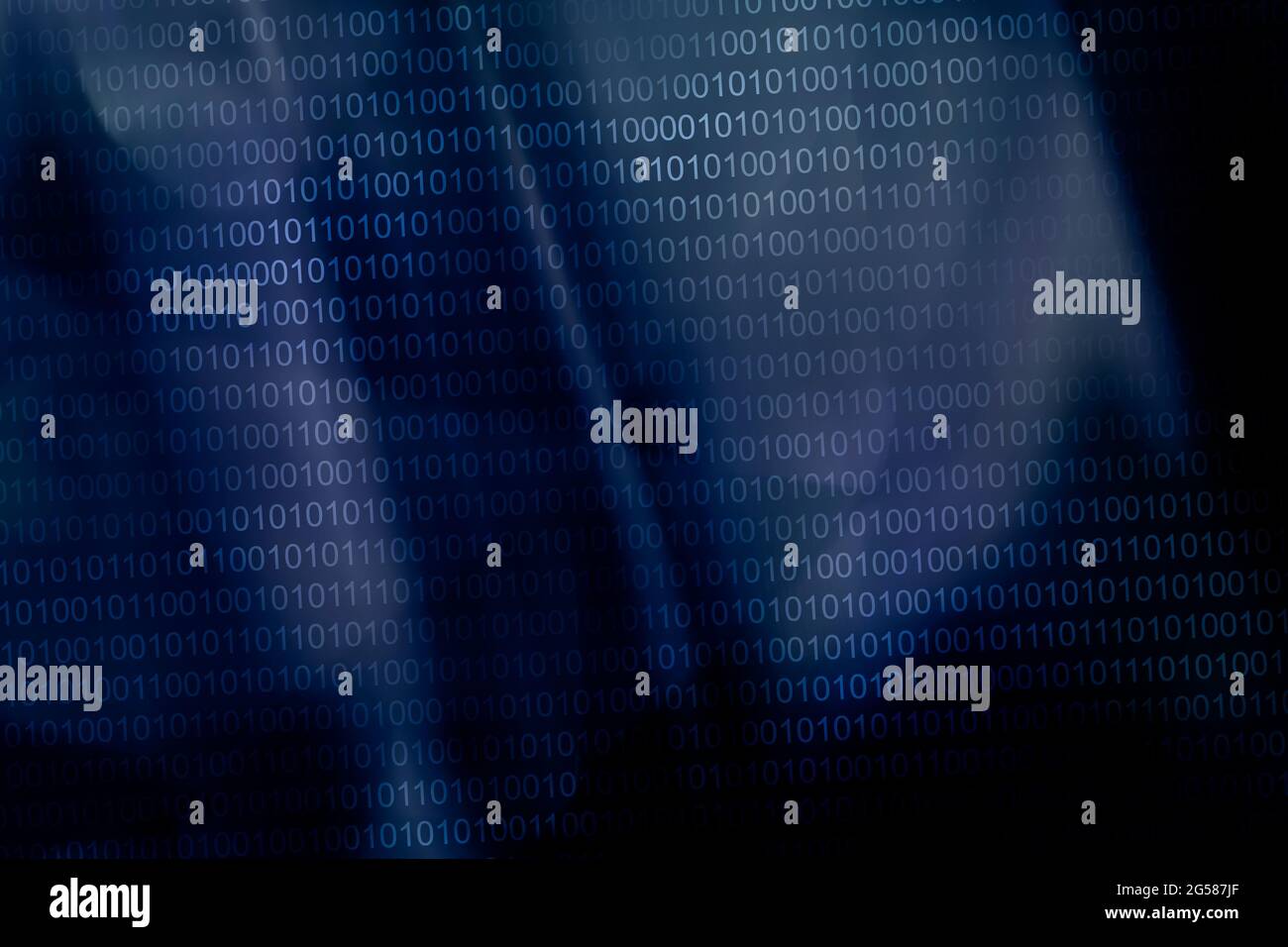 Binary code on dark background Stock Photo - Alamy