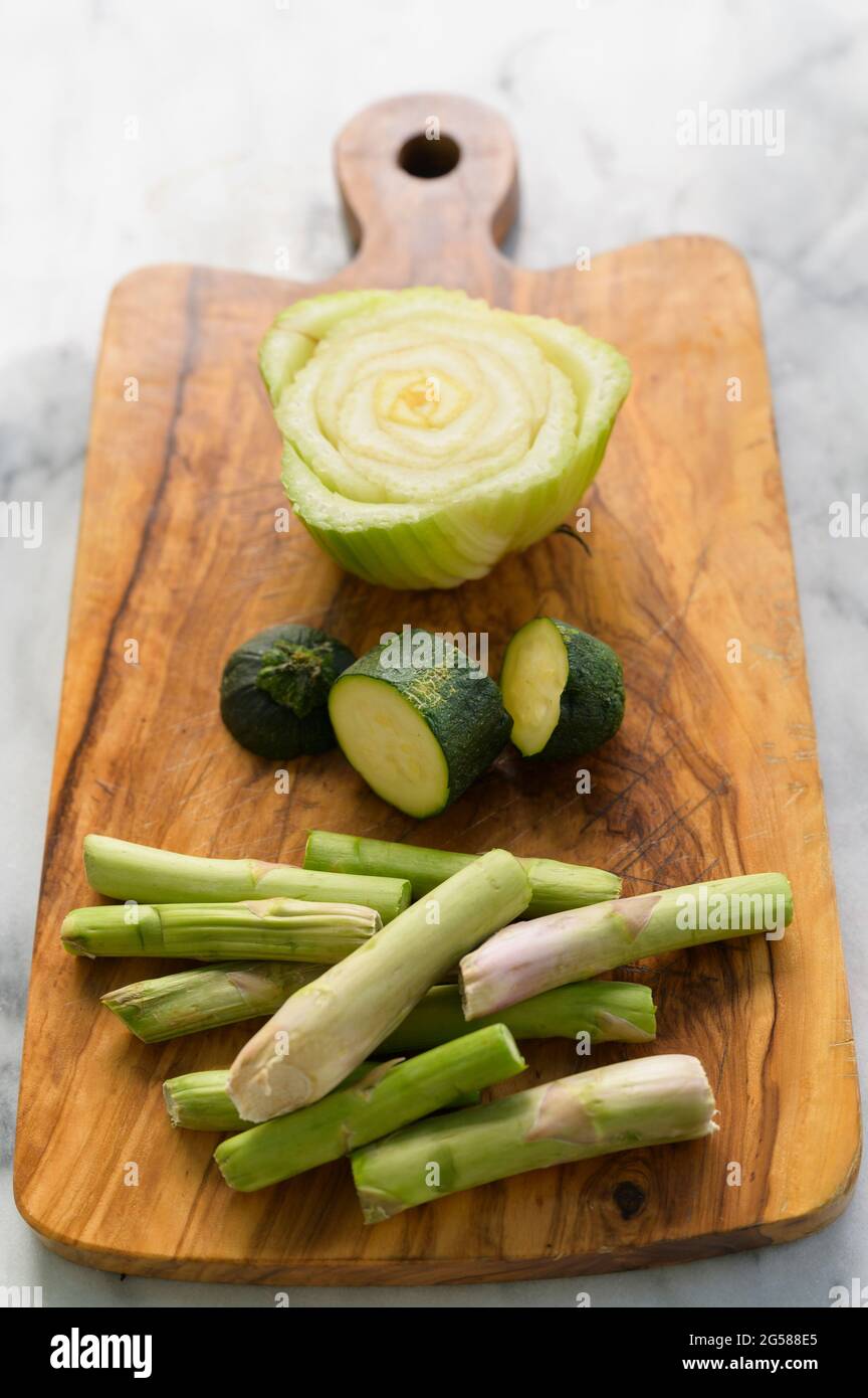 Vegetable scraps ready for compost on wooden cutting board Stock Photo ...
