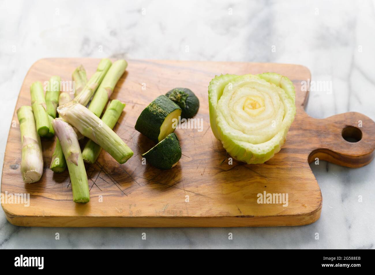 Vegetable scraps ready for compost on wooden cutting board Stock Photo ...