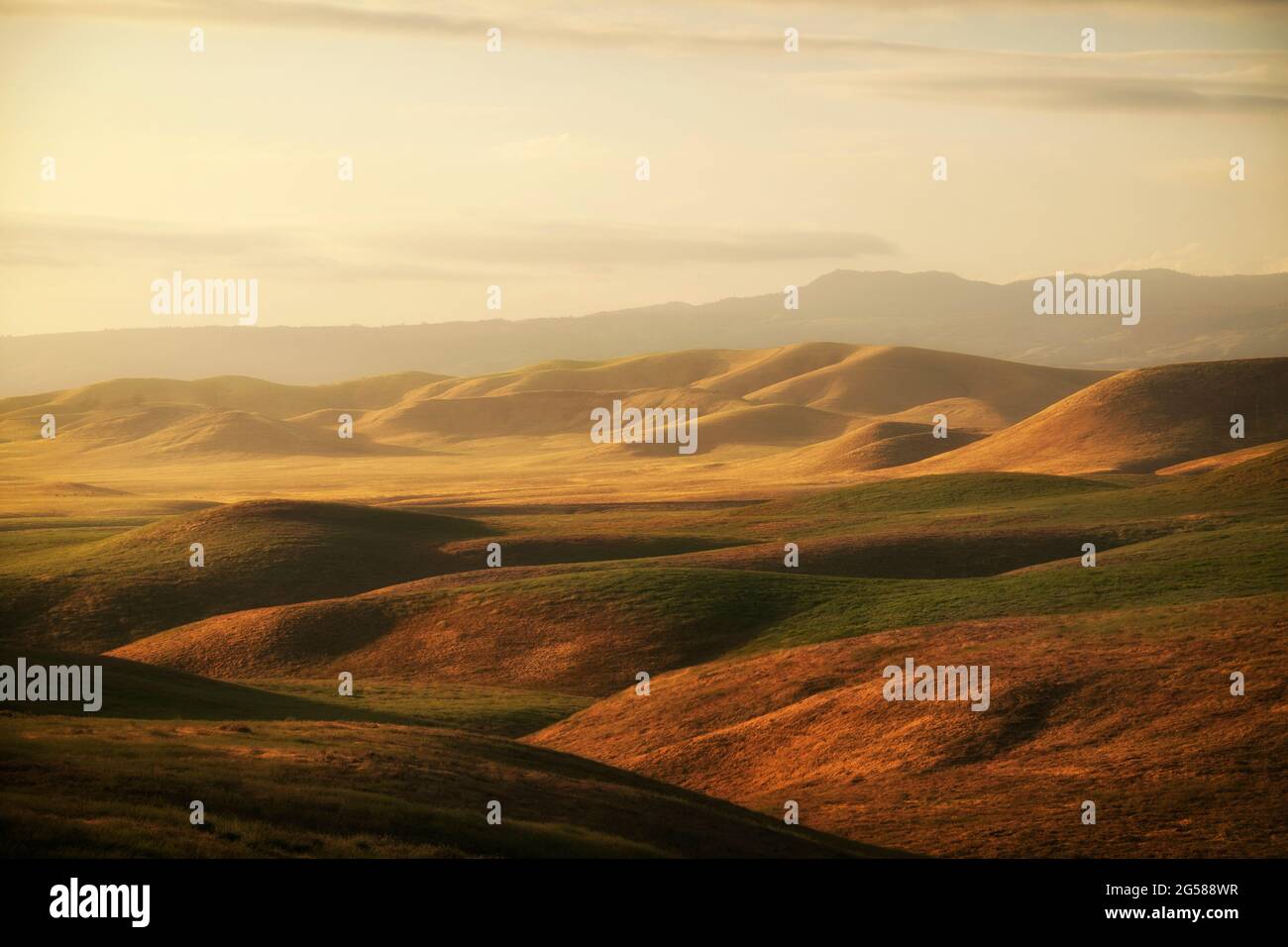 Hilly landscape at sunset hi-res stock photography and images - Alamy