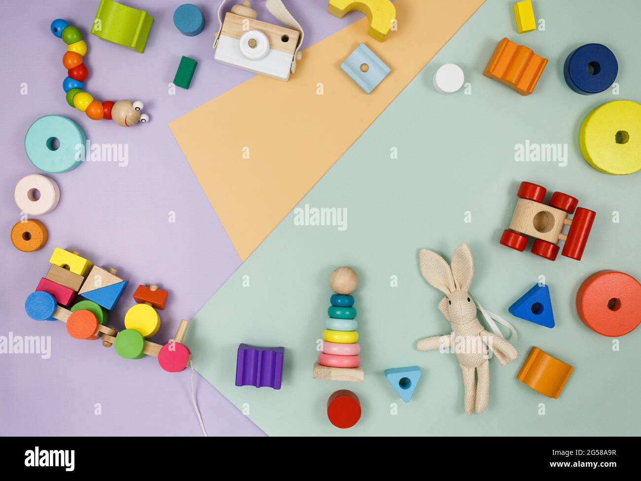 Wooden baby cubes on violet-green beige background. Educational toys ...