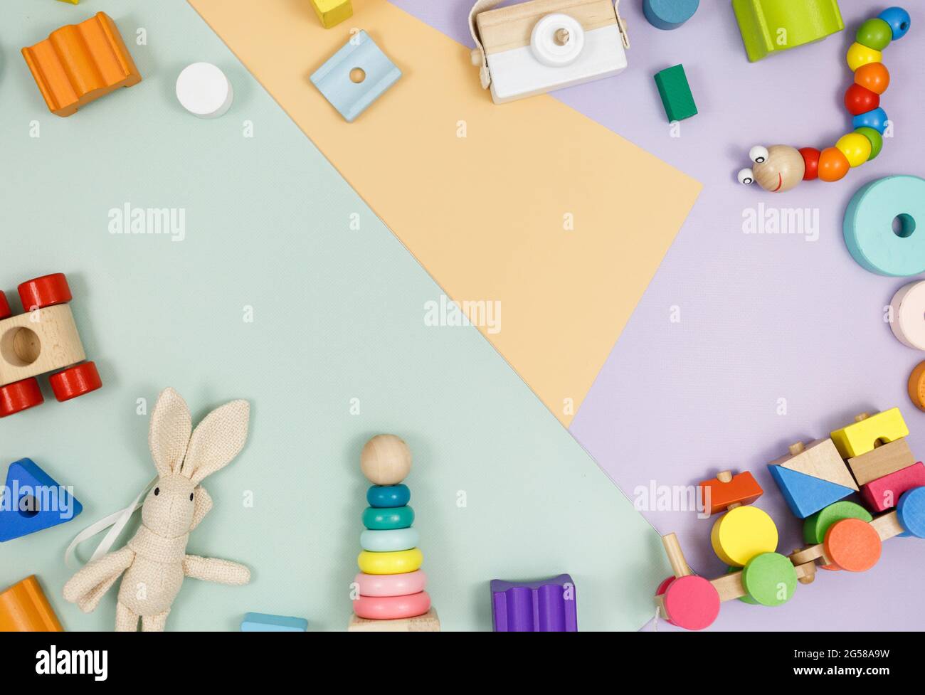 Wooden baby cubes on violet-green beige background. Educational toys ...