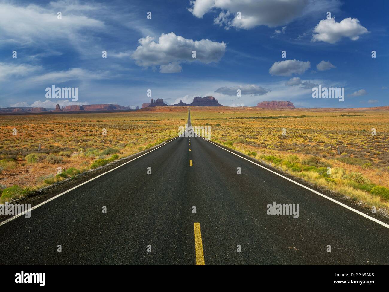 Arizona, Monument Valley Tribal Park, Empty road in desert leading to ...