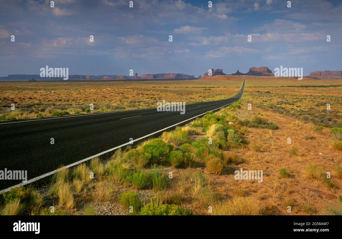 Arizona, Monument Valley Tribal Park, Empty road in desert leading to ...