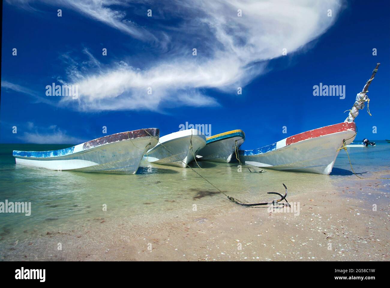 Mexico, Cancun, Yucatan, Traditional fishing boats on Caribbean beach ...
