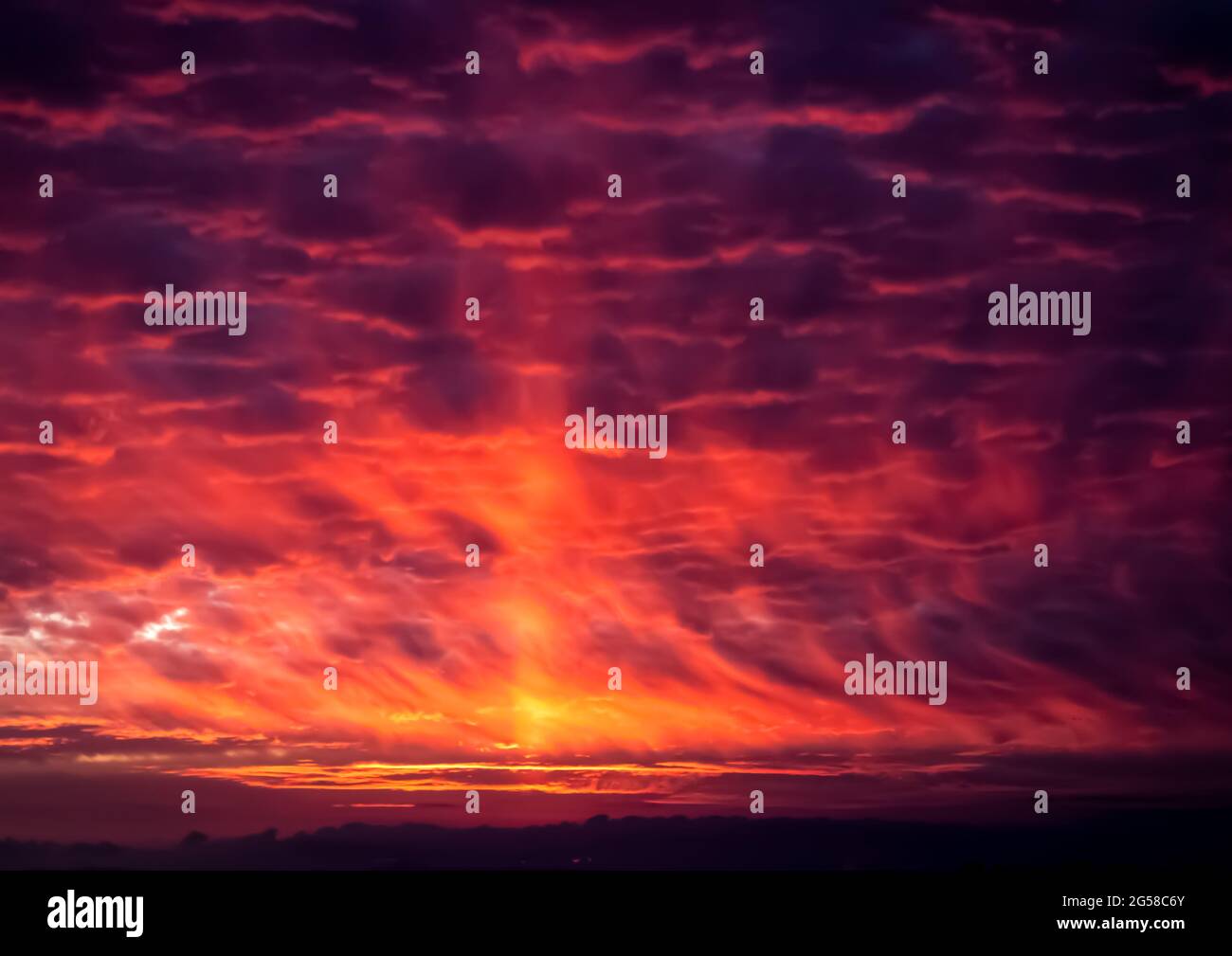 dramatic orange and purple sunset vivid colors Stock Photo - Alamy