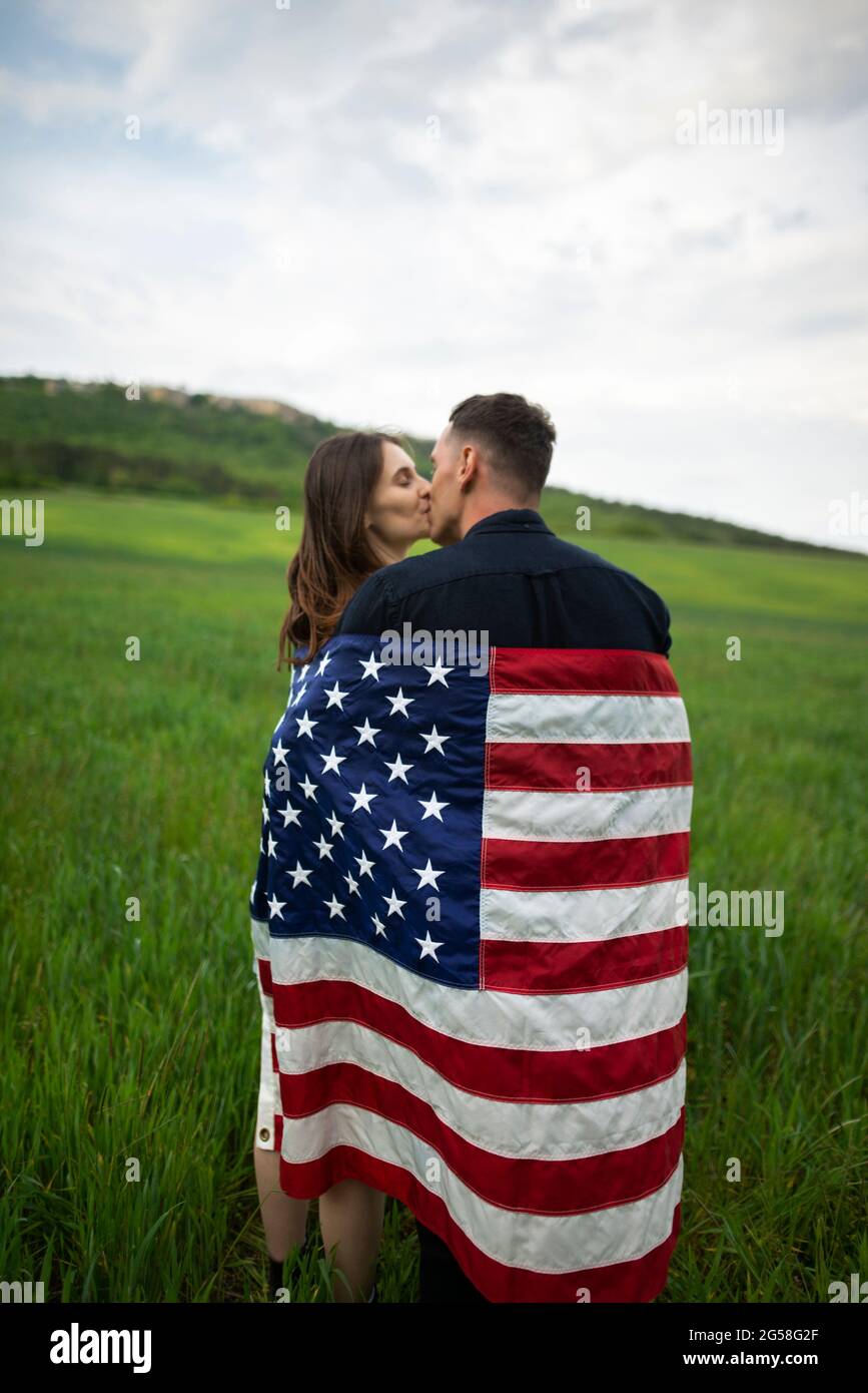 Couple wrapped in american flag hi-res stock photography and images - Alamy