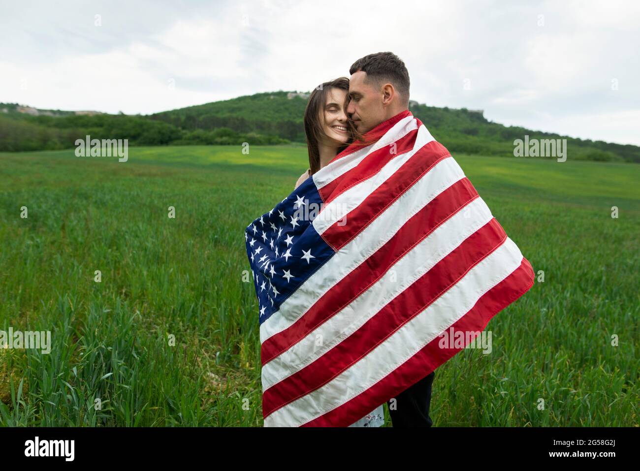 Couple wrapped in american flag hi-res stock photography and images - Alamy
