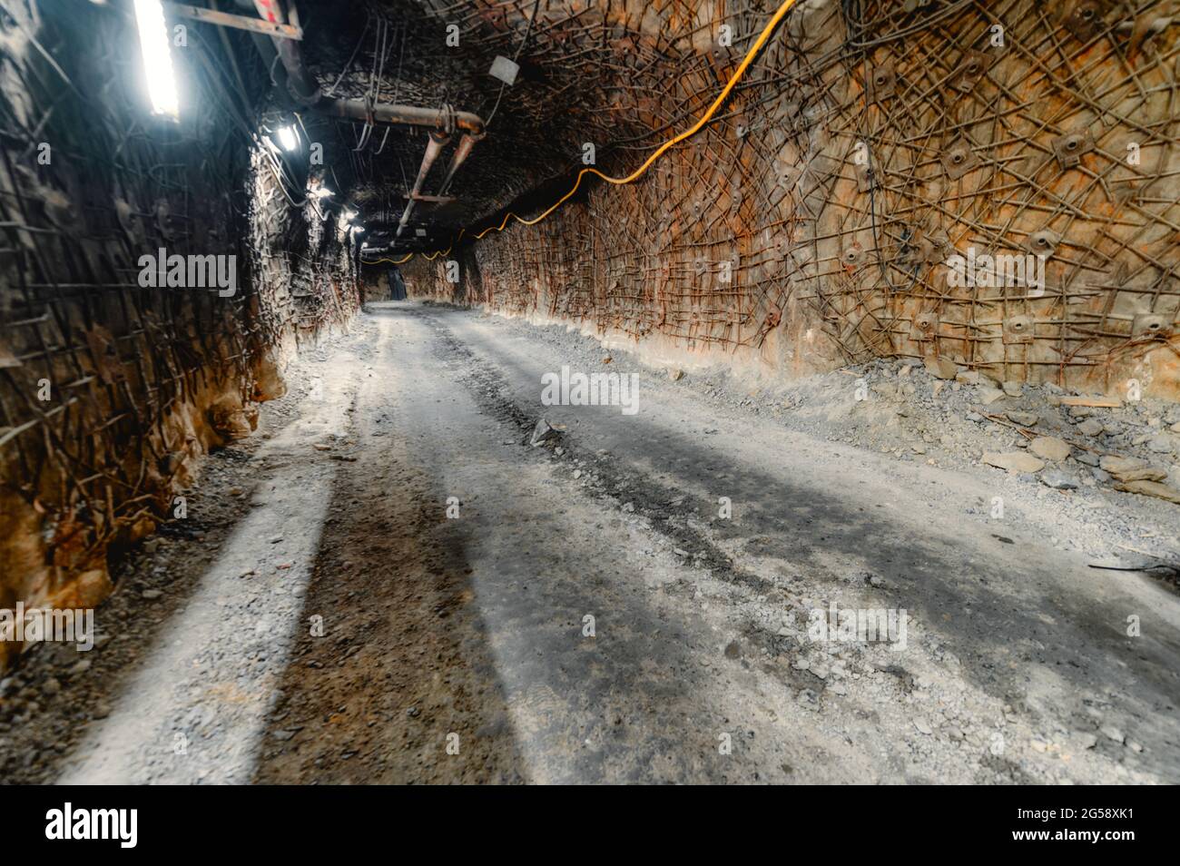 Underground mine. Underground road for transport. The walls and ceiling ...