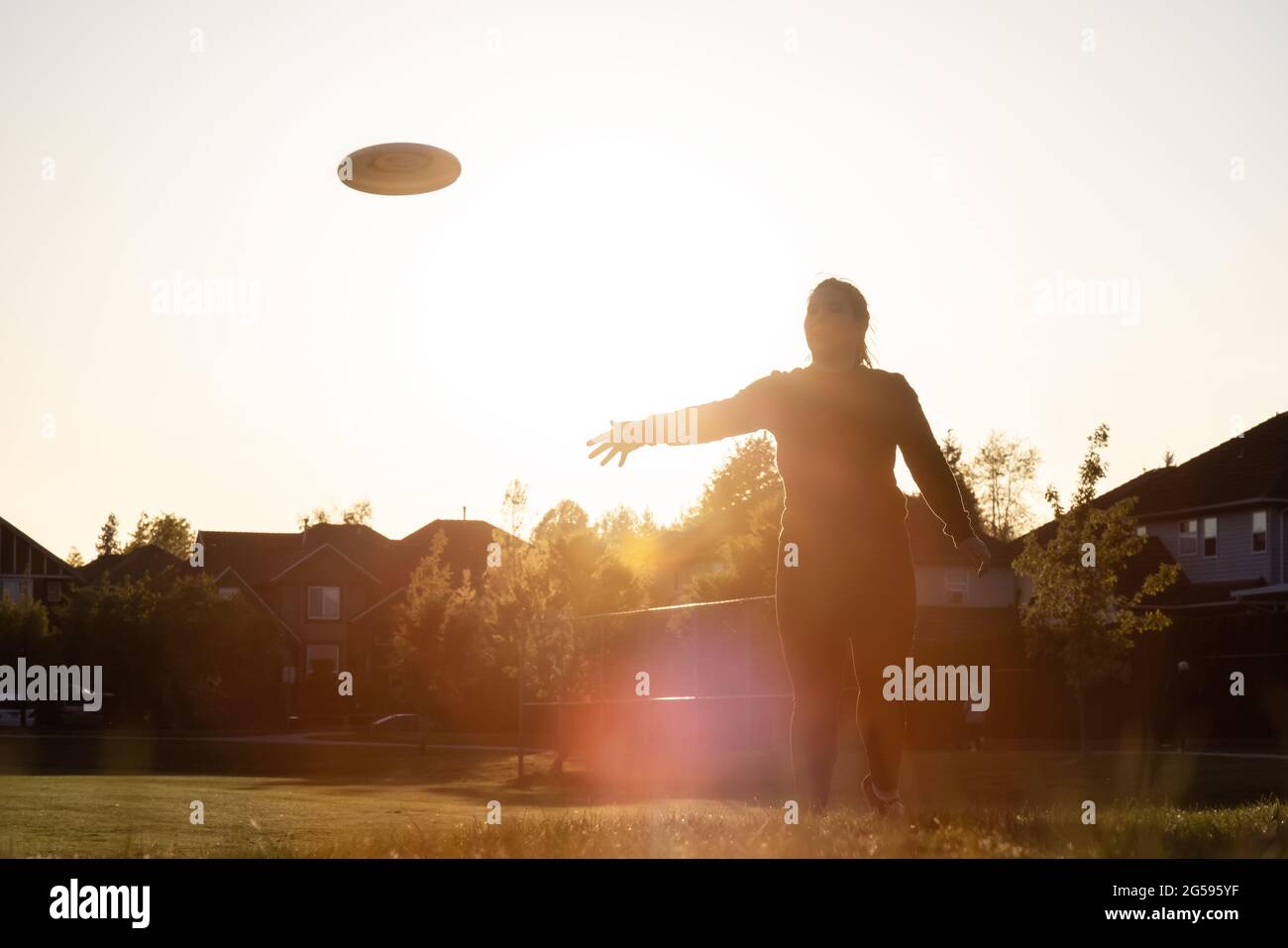 White Caucasian Adult Girl Playing Frisbee in the Green Field Stock ...
