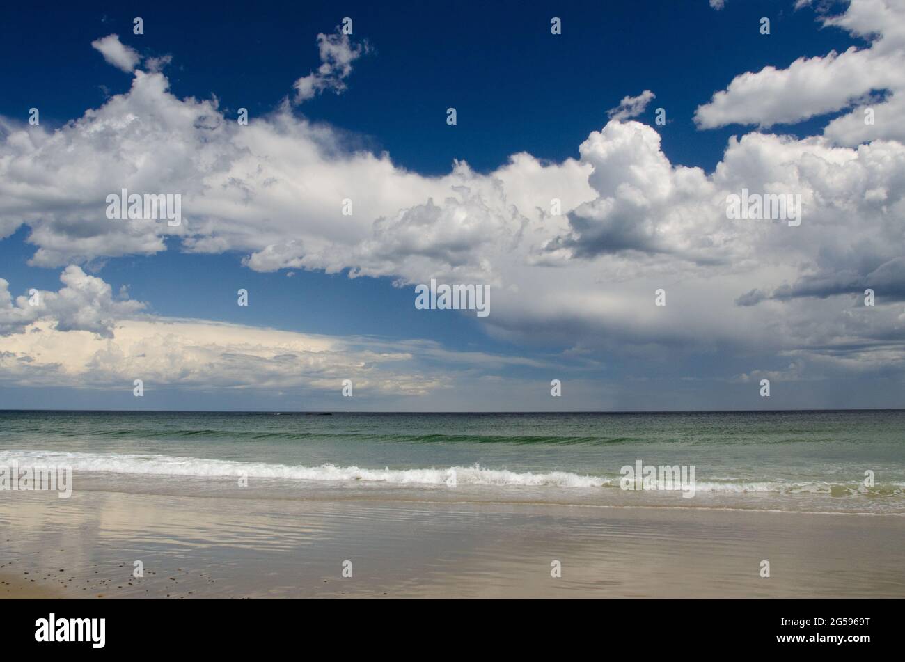 Sandy beach with clouds Stock Photo - Alamy