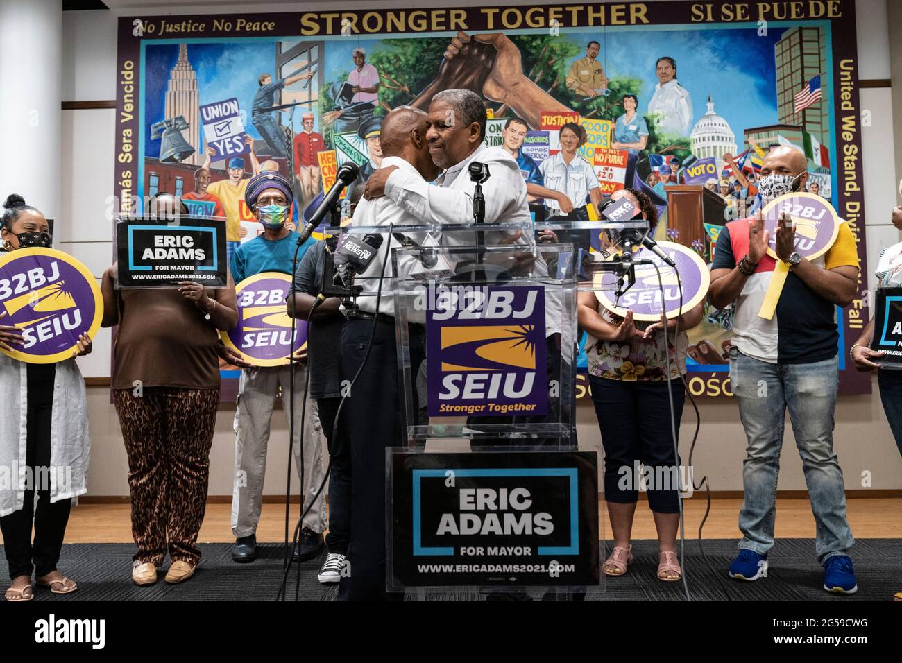 New York, NY - June 25, 2021: 32BJ SEIU Union President Kyle Bragg hugs ...
