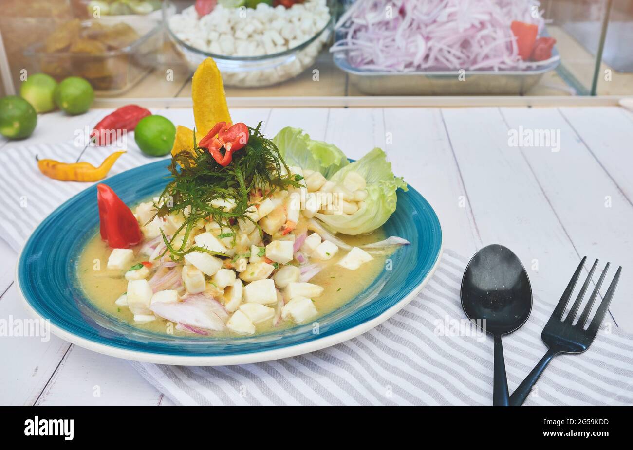 Peruvian food: fish ceviche de pota with fried cassava, sweet corn and ...