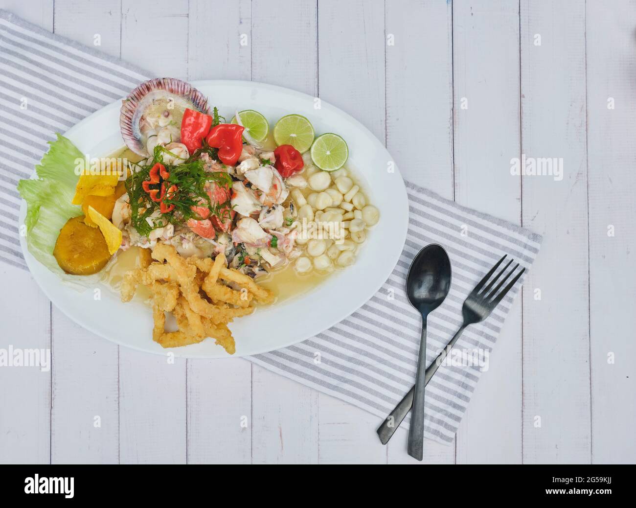 Typical Peruvian food, squid ceviche, shrimp, crab and white fish with ...