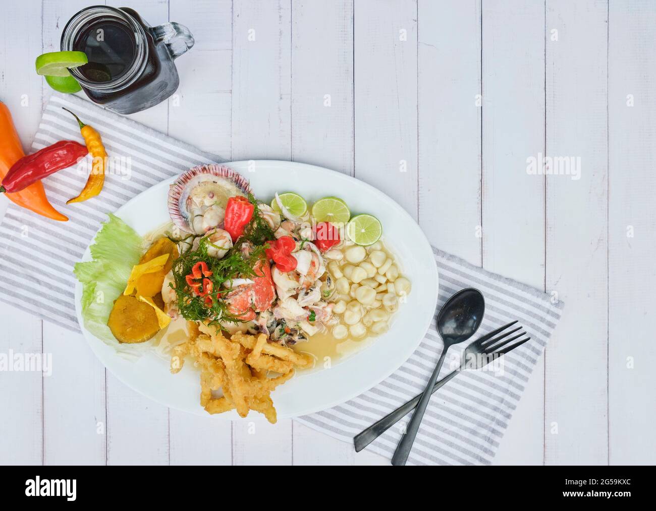 Typical Peruvian food, squid ceviche, shrimp, crab and white fish with ...