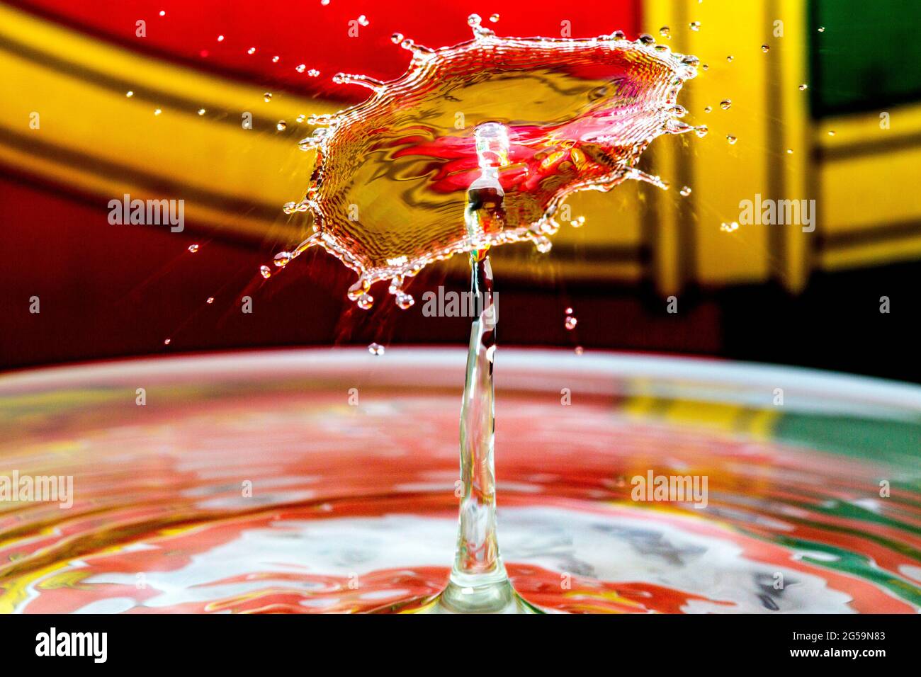 Colour splash of a water drop collision Stock Photo - Alamy