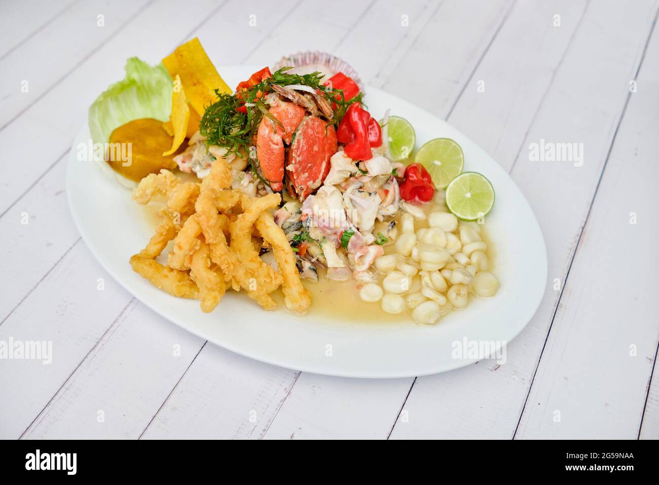 Typical Peruvian food, squid ceviche, shrimp, crab and white fish with ...