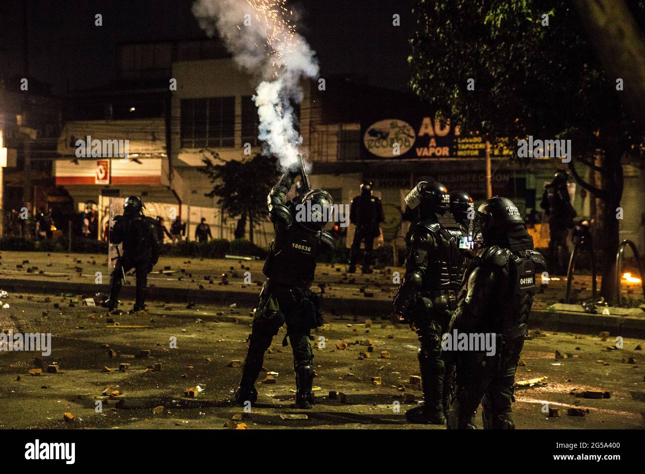 An anti-riot police fires tear gas at the protesters during the ...