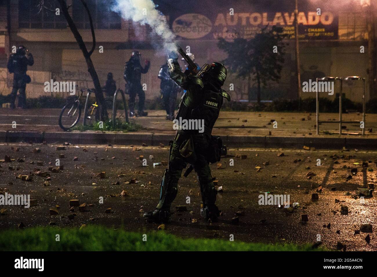 An anti-riot police fires tear gas at the protesters during the ...