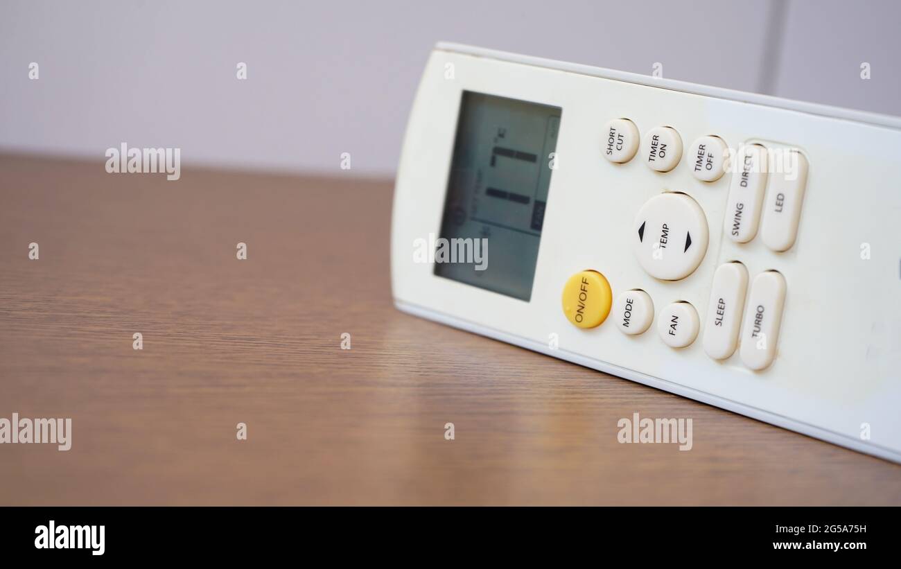 Remote Air Conditioner on the table Stock Photo - Alamy