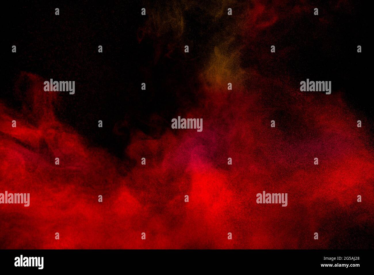 Red particles explosion on black background.Freeze motion of red dust ...