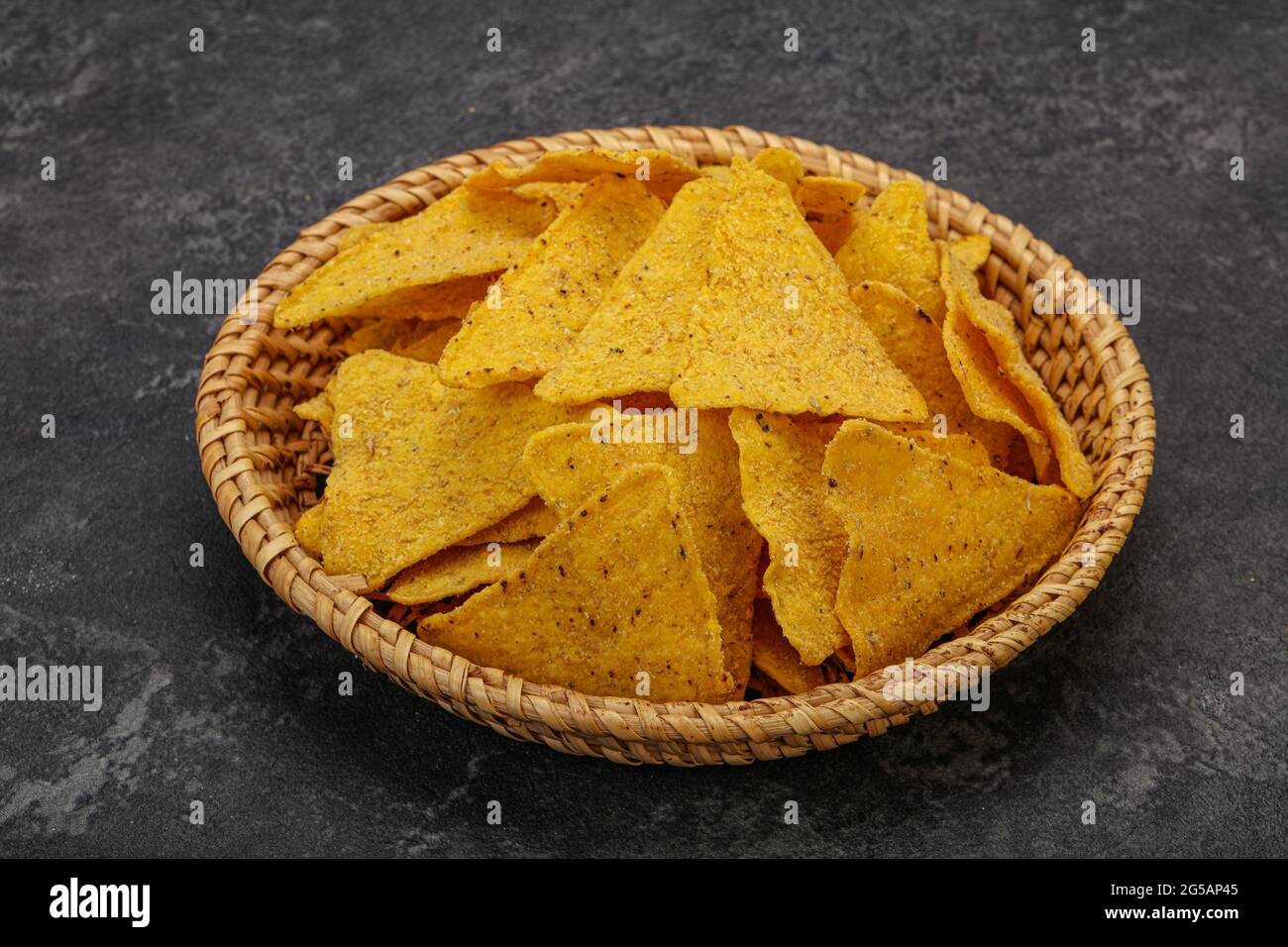 Mexican crunchy corn nachos triangle heap Stock Photo - Alamy