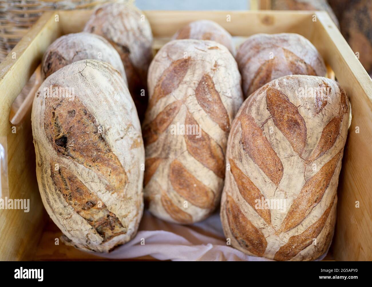 Loaves of fresh baked bread at a farmers market Stock Photo - Alamy