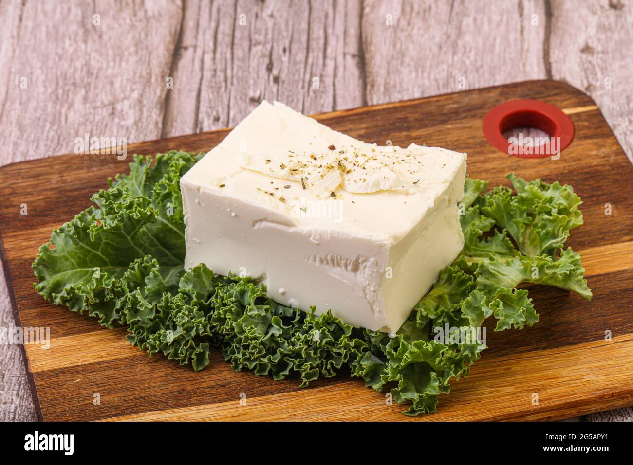 Traditional tasty Greek Feta soft cheese brick Stock Photo - Alamy