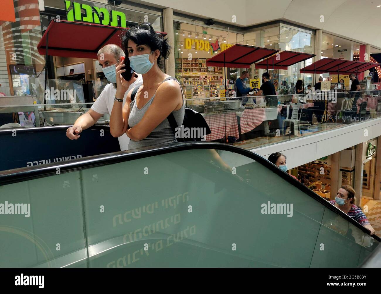 Modiin, Israel. 25th June 2021. Israelis with masks are seen in a ...