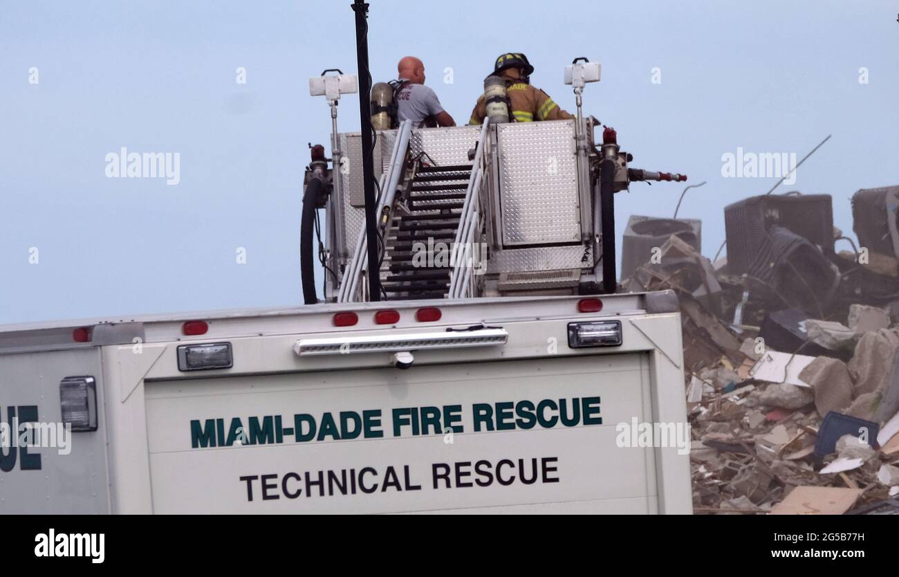 Surfside, USA. 25th June, 2021. Miami-Dade fireman and rescue workers ...