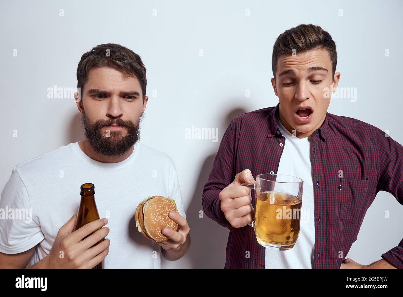 Man eating hamburger drinking beer hi-res stock photography and images ...