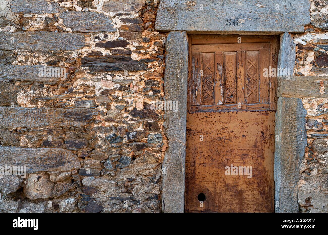 Old run-down wooden door with slate jamb Stock Photo - Alamy