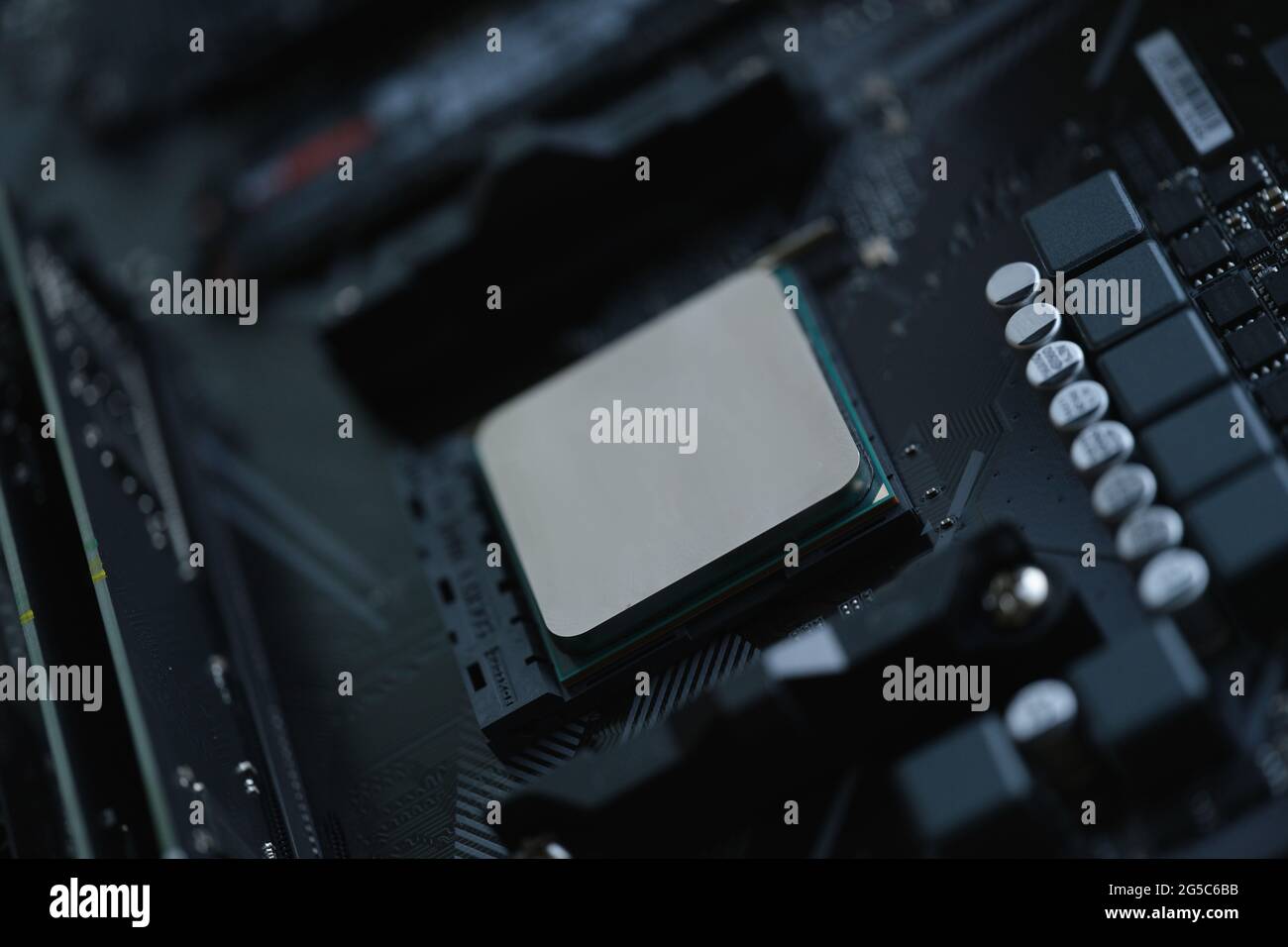 Computer processor in silver is installed in motherboard closeup Stock ...
